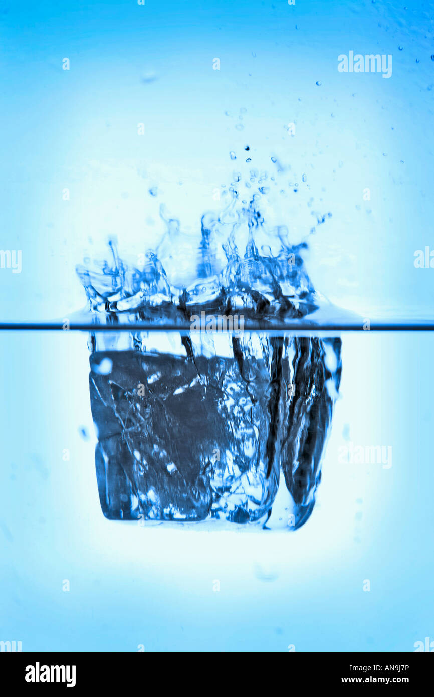 ICE CUBE SPLASHING INTO WATER Stock Photo - Alamy
