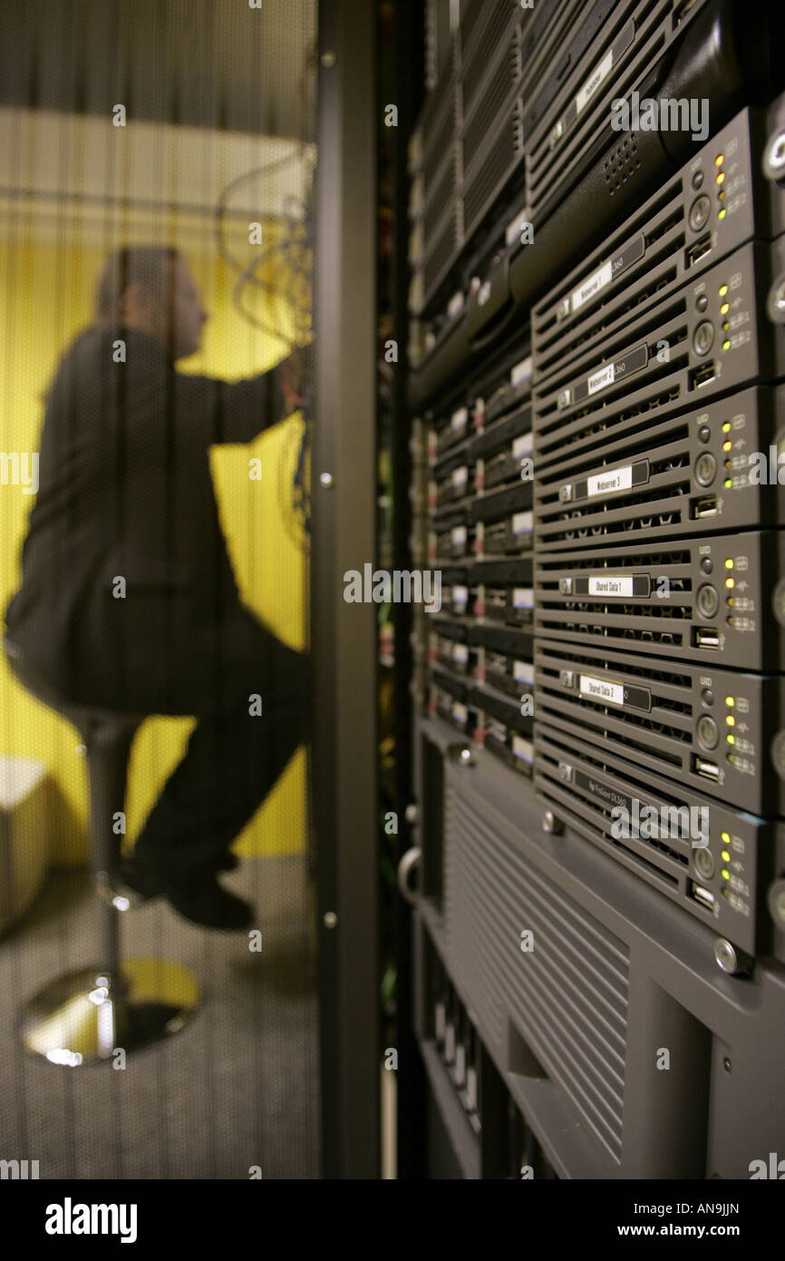 A COMPUTER ENGINEER CARRYING OUT MAINTENANCE ON A SERVER Stock Photo ...