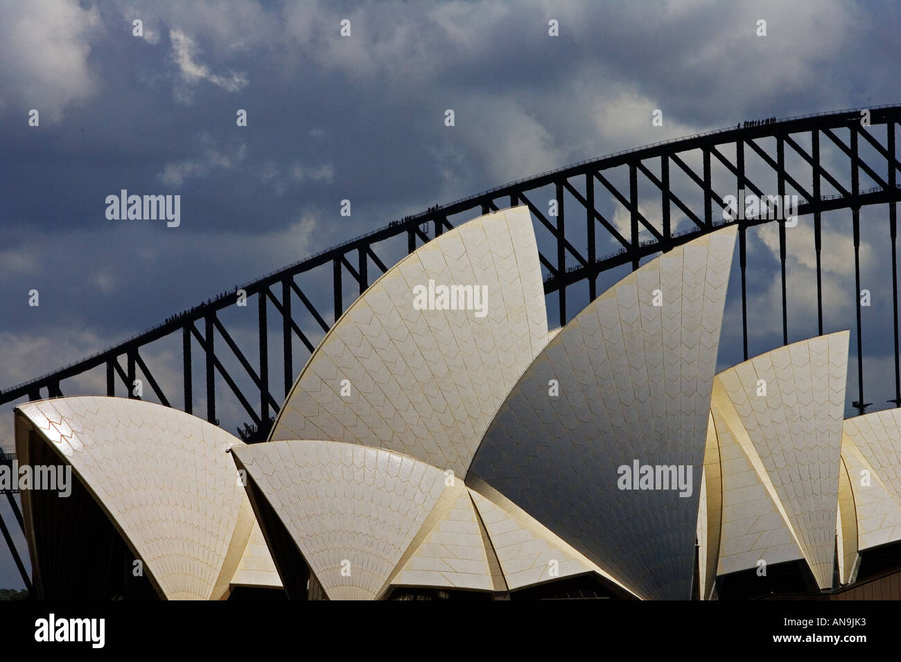 Sydney Opera House and tourists walking over the Sydney Harbour Bridge ...
