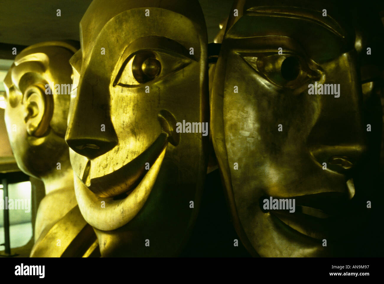 sculptured masks at the entrance to the Barbican theatre London UK ...