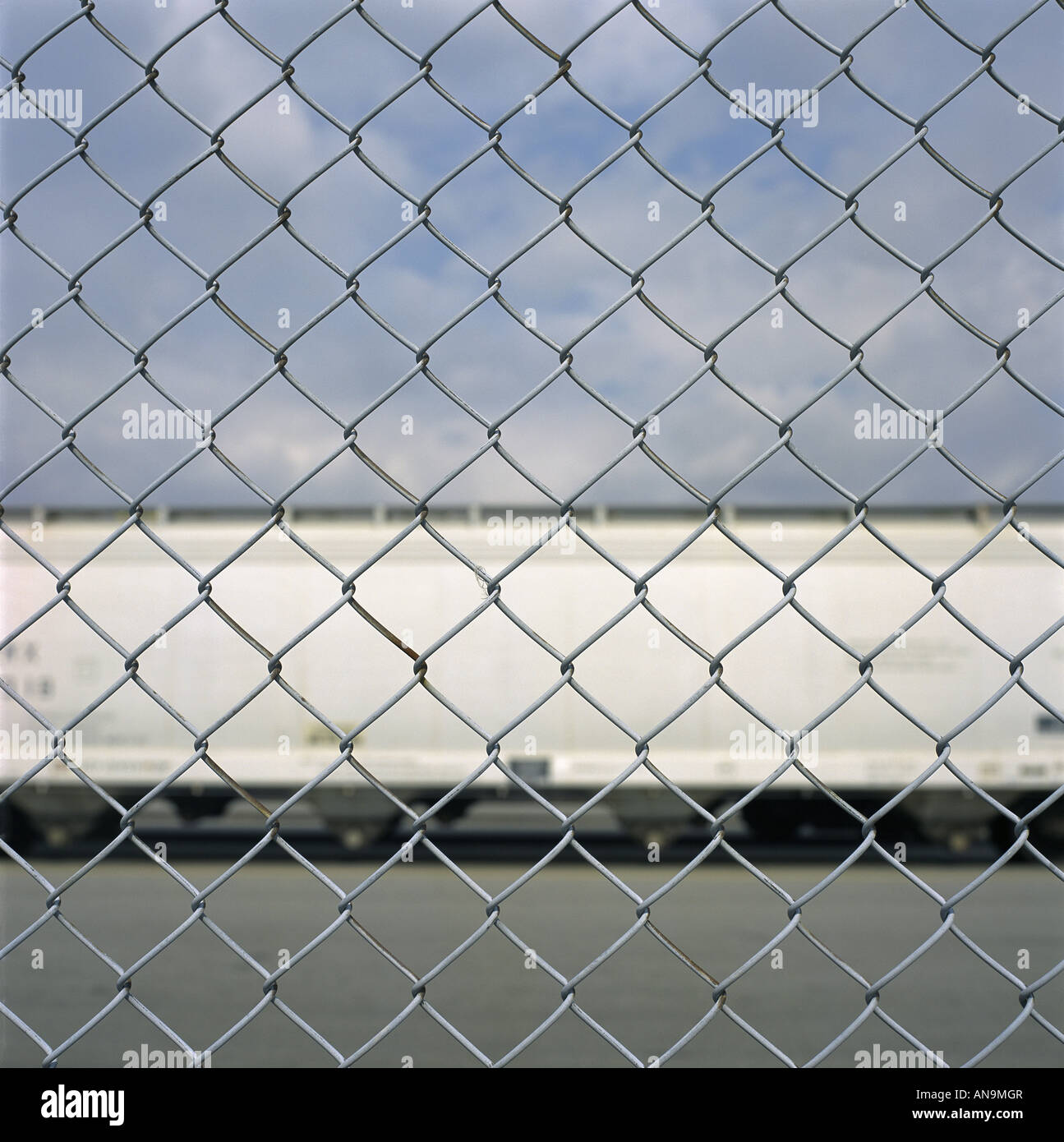 train behind fence Stock Photo - Alamy