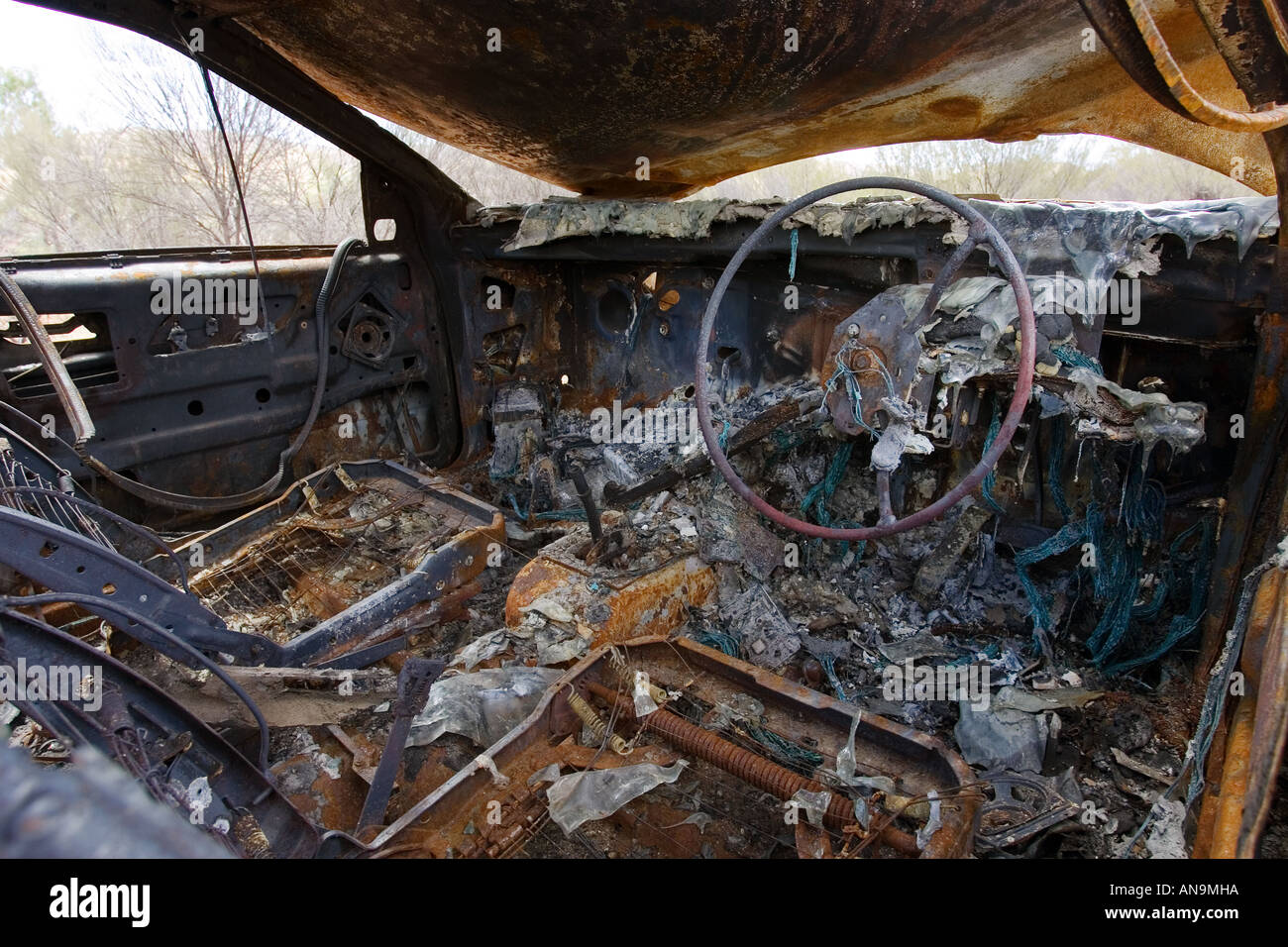 Inside burnt out car wreck on road from Alice Springs Namatjira Drive ...