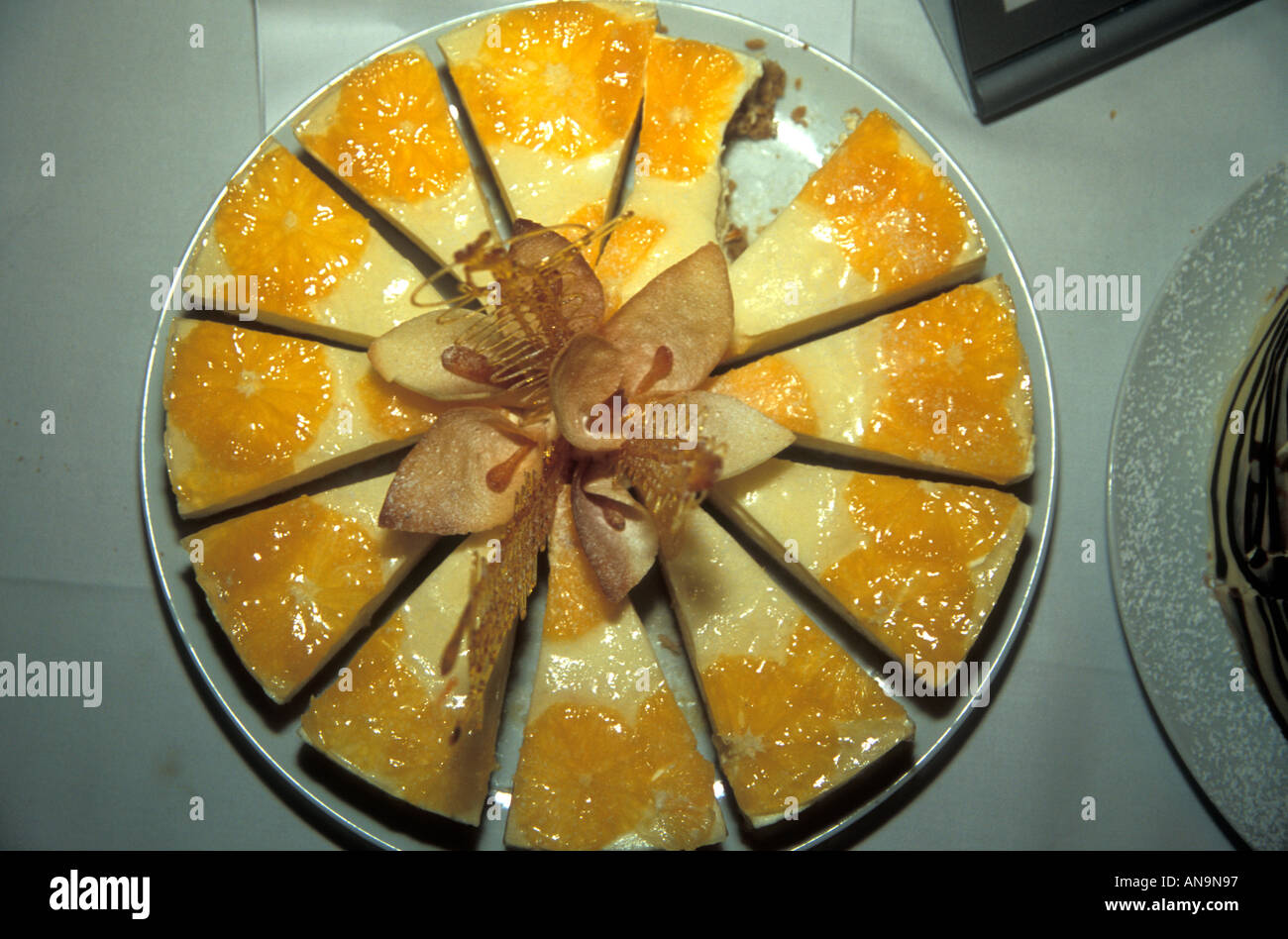 Orange cheesecake on display at a food fair Stock Photo - Alamy
