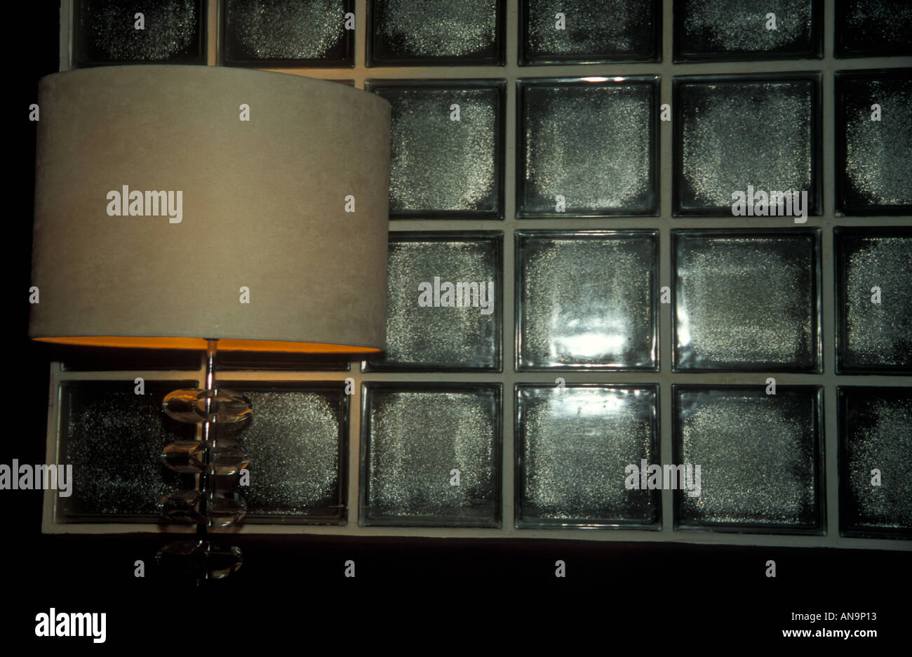 Lamp by the side of a glass wall Stock Photo - Alamy