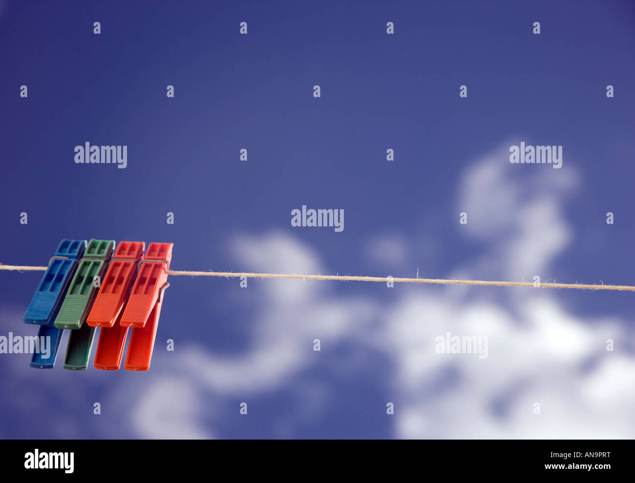 Plastic Clothes Pegs on a Washing Line Stock Photo - Alamy