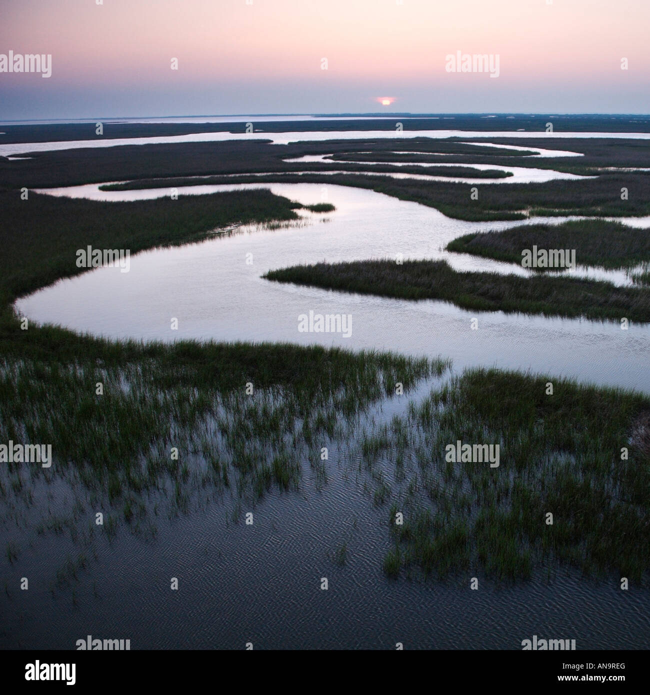 Aerial scenic view of winding waterway in marshland at Baldhead Island ...