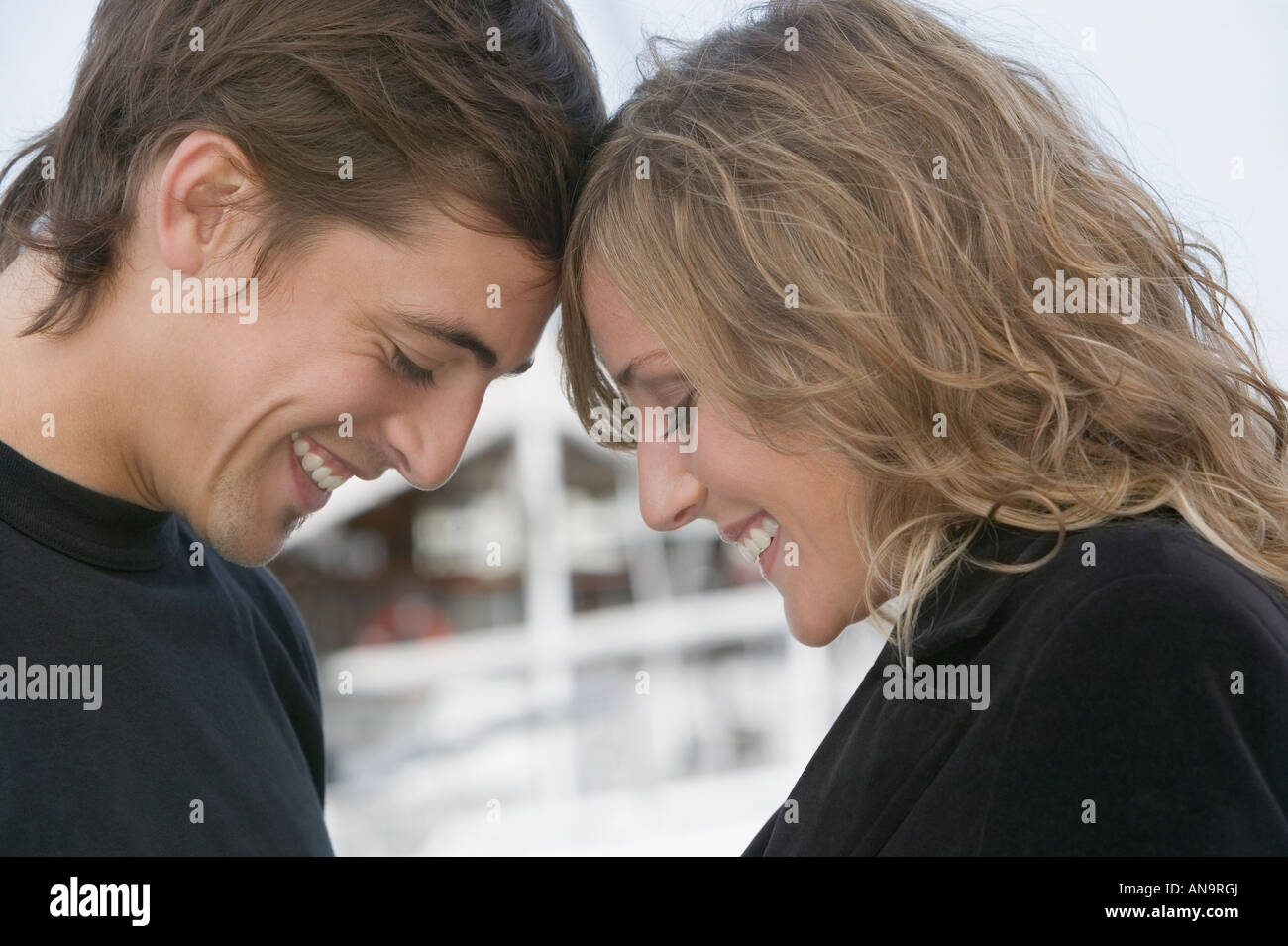 Two women touching forehead hi-res stock photography and images - Alamy