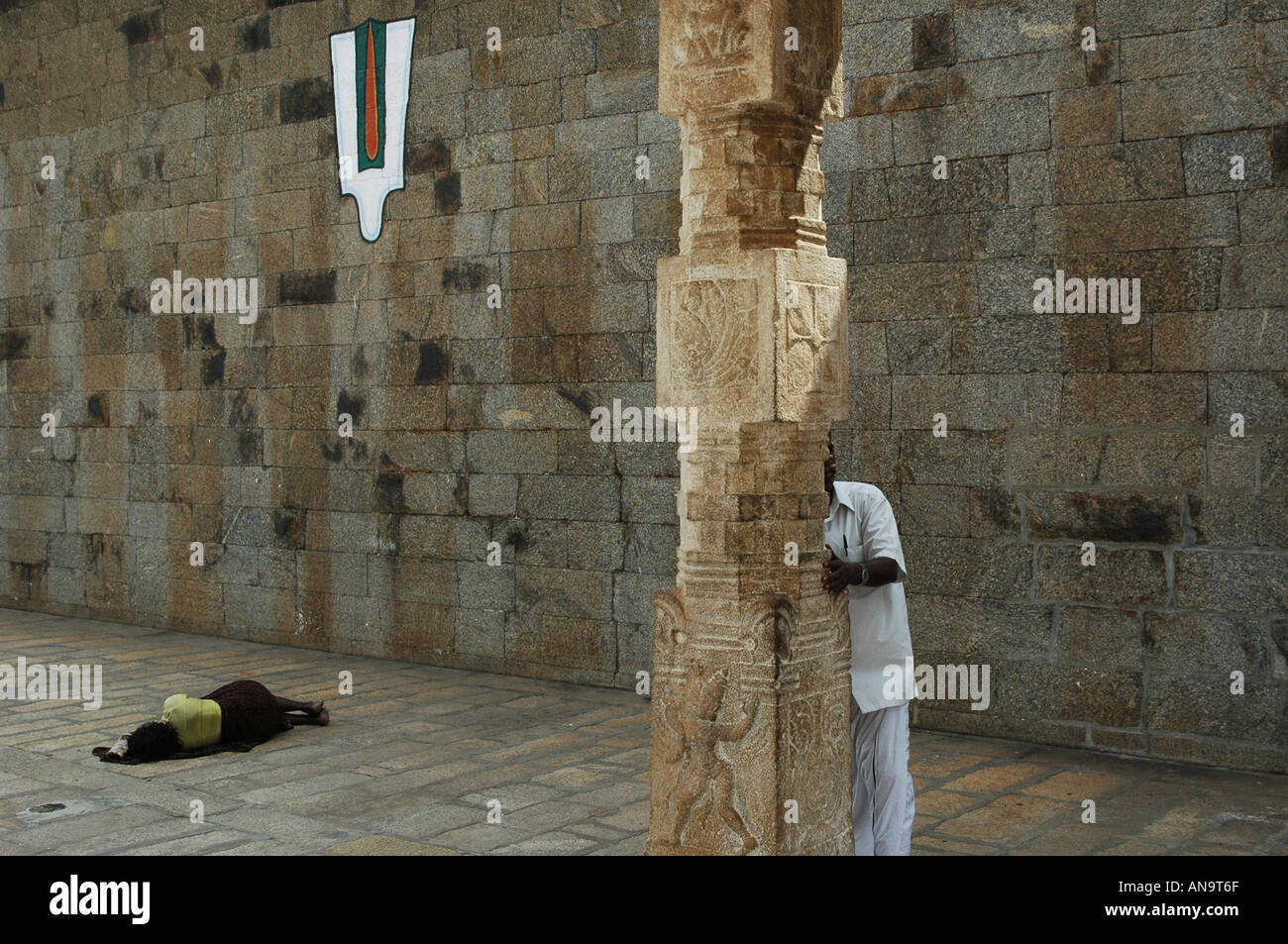 South Indian Temple in the city of Tiruchhirapalli Old beggar of low ...