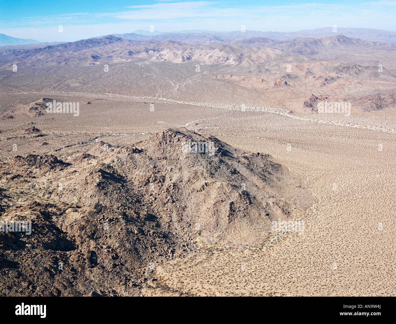 Aerial view of remote California desert with mountain range in ...