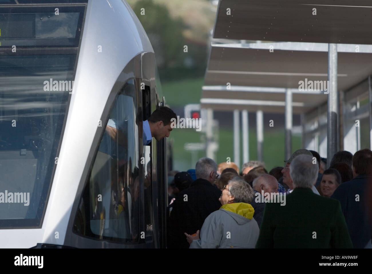 Malles to Merano, Italian train driver leaning out of window to listen ...