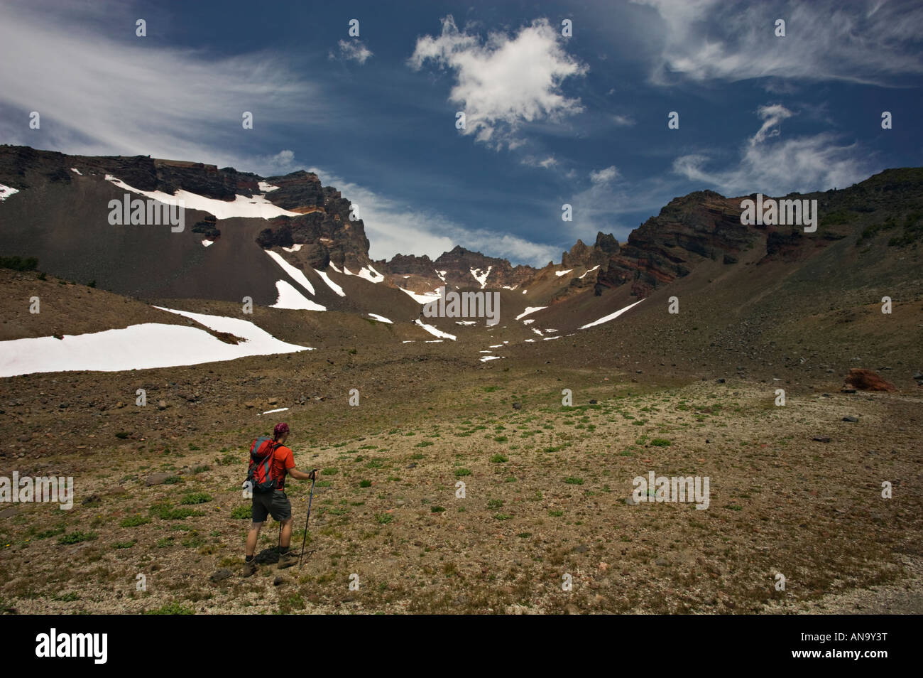 Backpacker below Broken Top Stock Photo - Alamy
