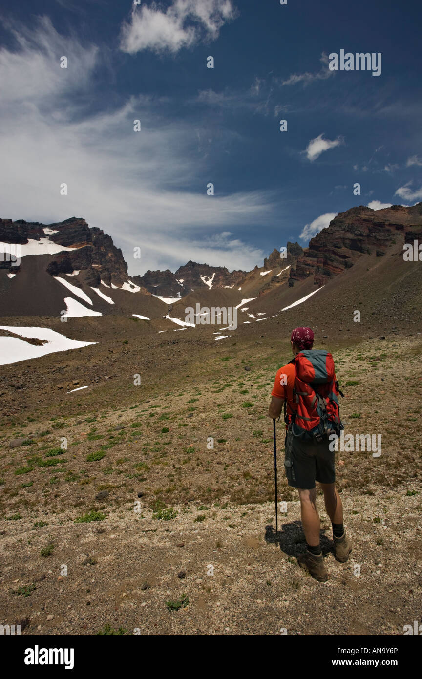 Backpacker below Broken Top Stock Photo - Alamy