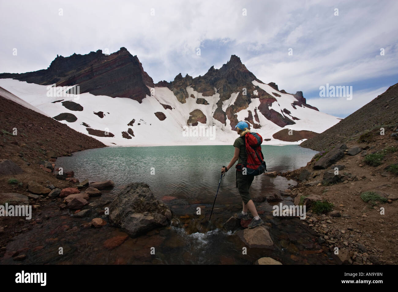 Backpacker below Broken Top Stock Photo - Alamy