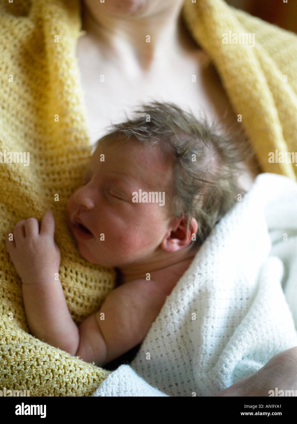 woman cuddling her newborn baby Stock Photo - Alamy