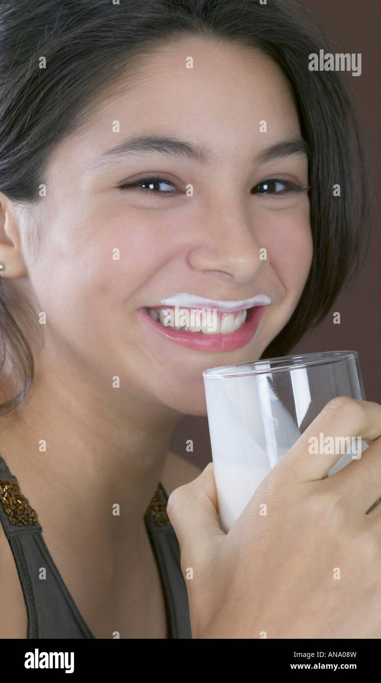 Hispanic girl drinking milk Stock Photo - Alamy