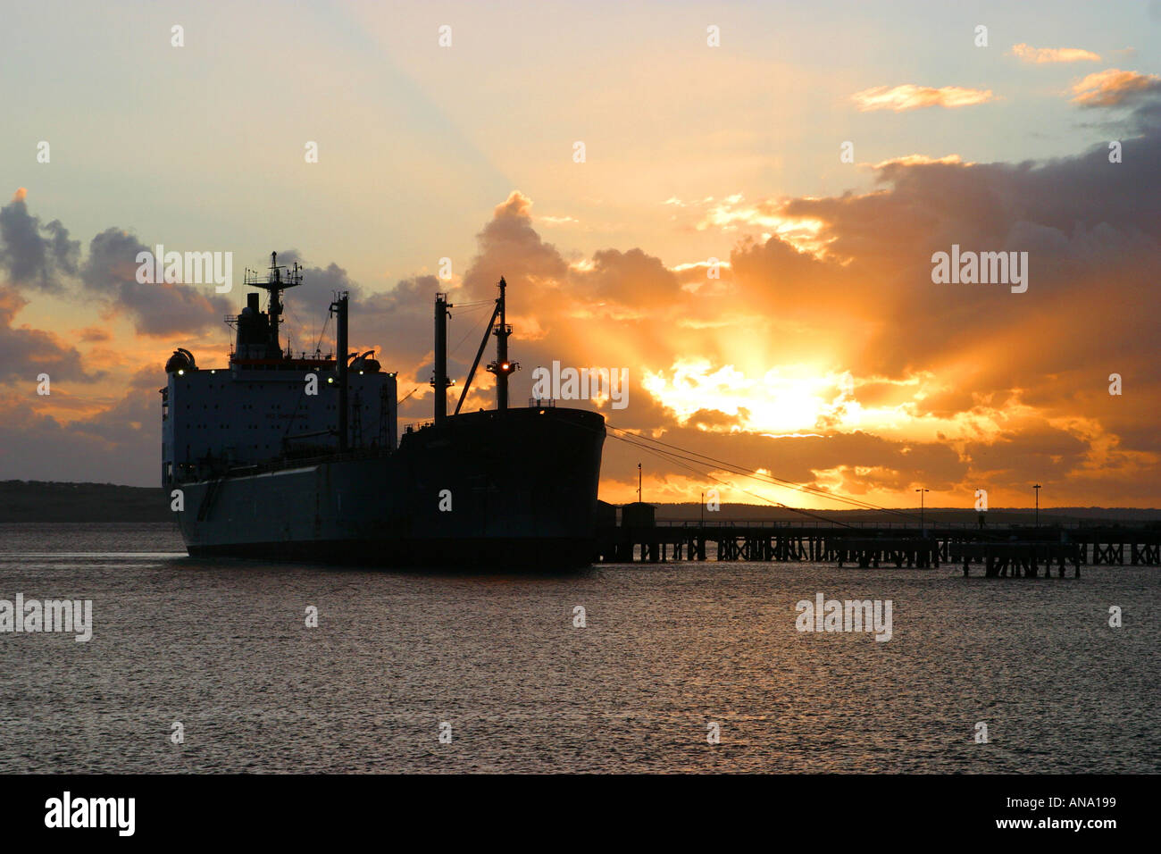 Sun rays over a ship Stock Photo - Alamy