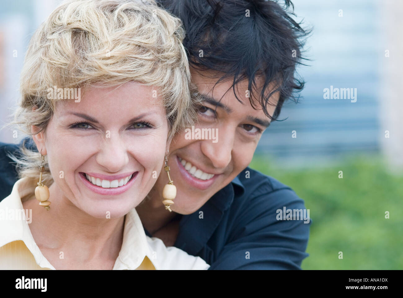 Portrait of couple hugging Stock Photo - Alamy