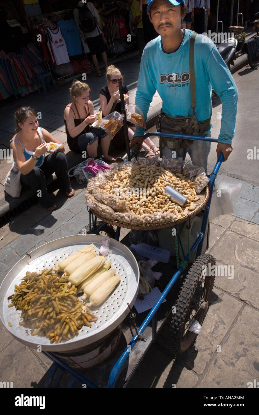 Mobile street vendor selling peanuts and corn on the cob (maize ...