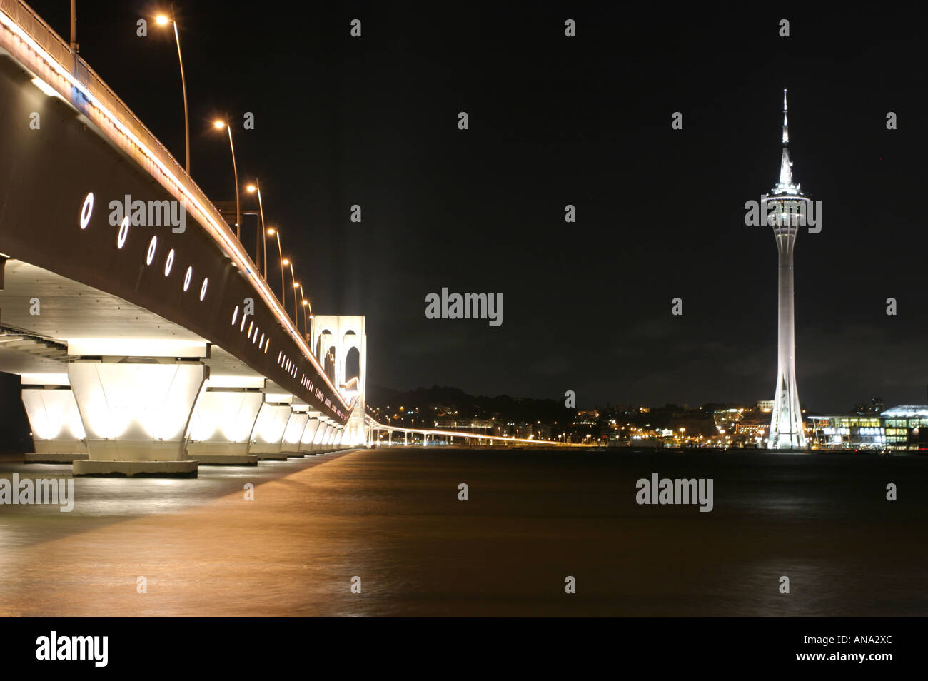 Macau tower and Macau Bridge by night Stock Photo - Alamy