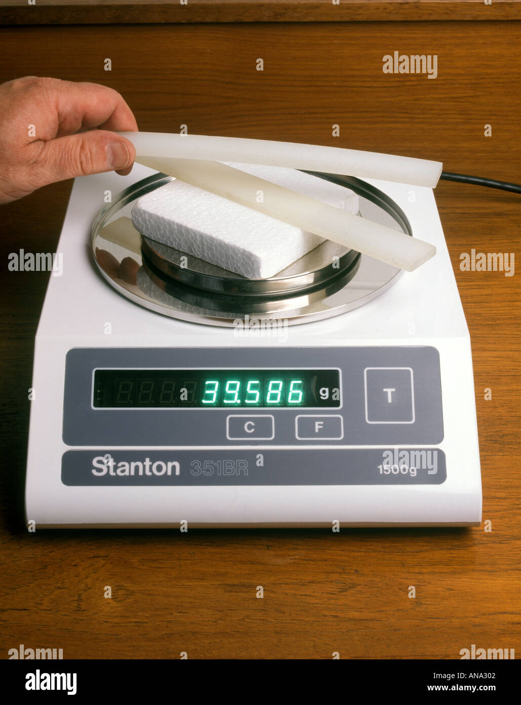 measuring the force of attraction between a polythene rod and expanded ...