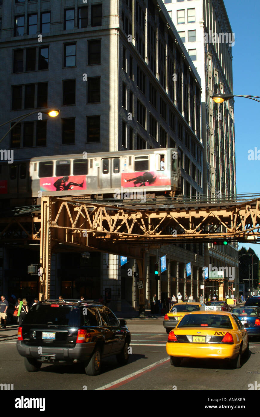 A Train on The Loop Railway Line over Monroe Street with Car and Taxi ...