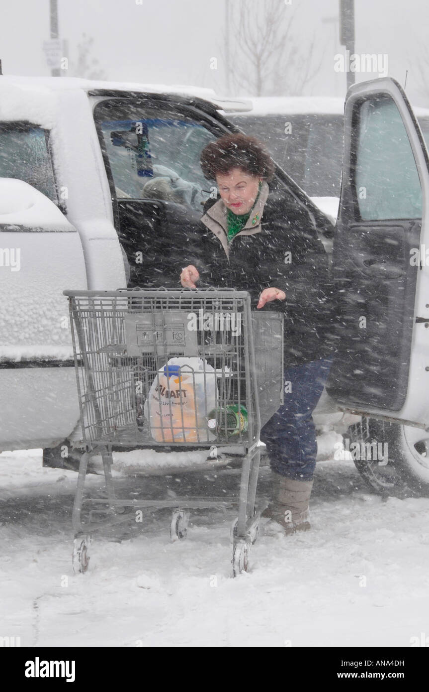 Grocery shopping during a winter snow storm during the Winter season in ...