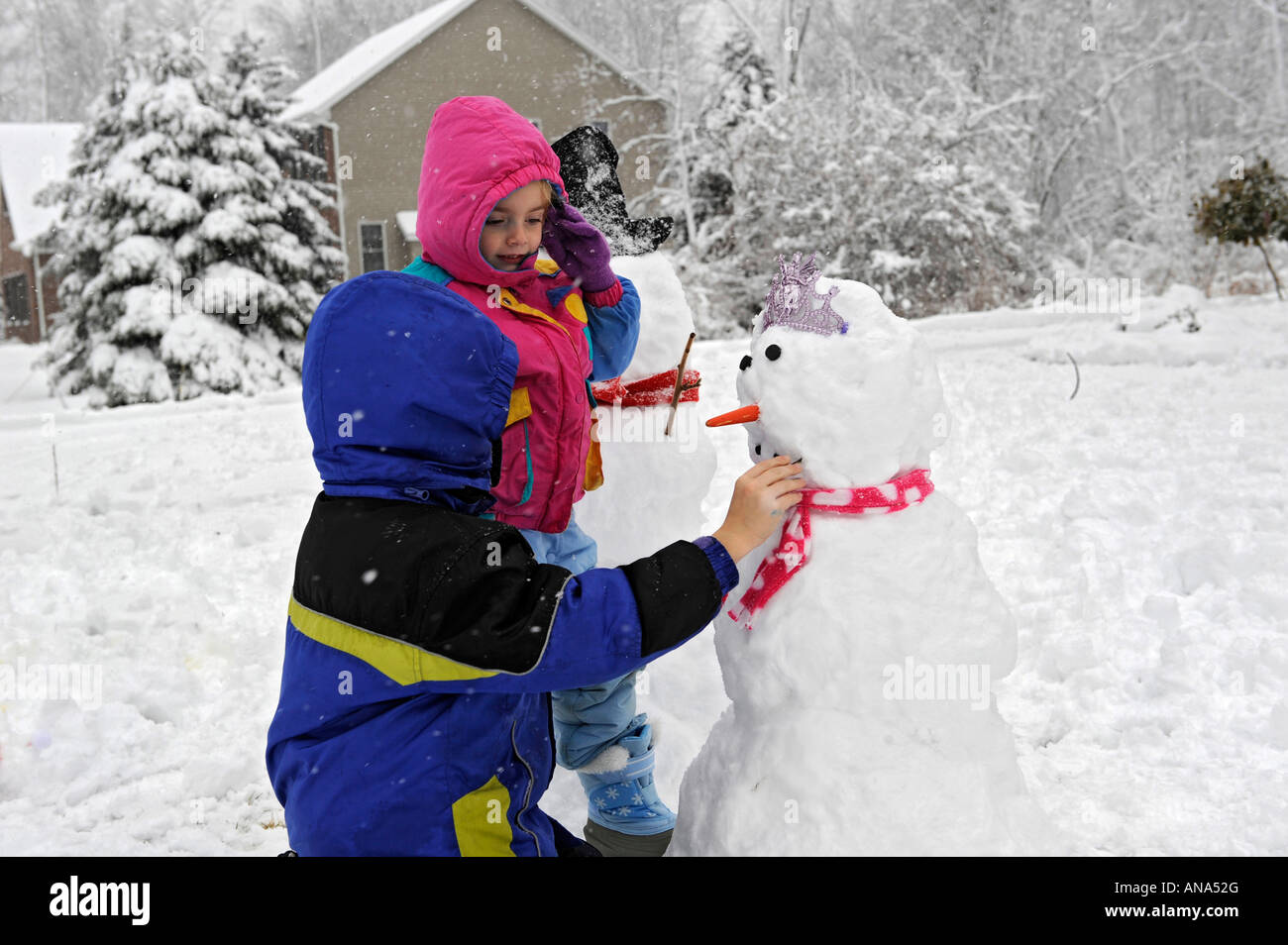 Children making snowman hi-res stock photography and images - Alamy