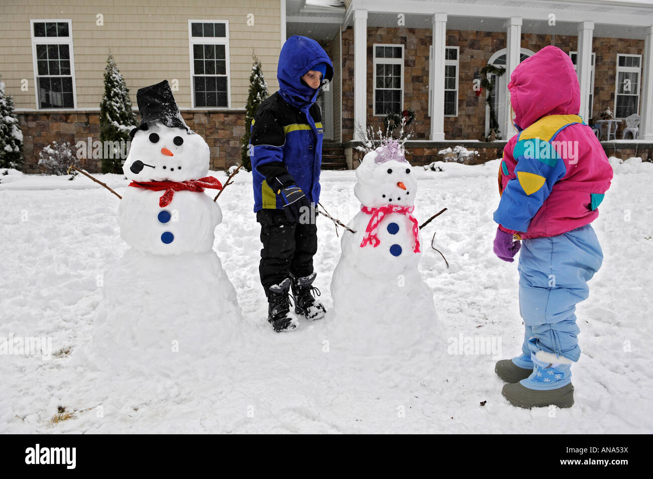 Child making snow man hi-res stock photography and images - Alamy
