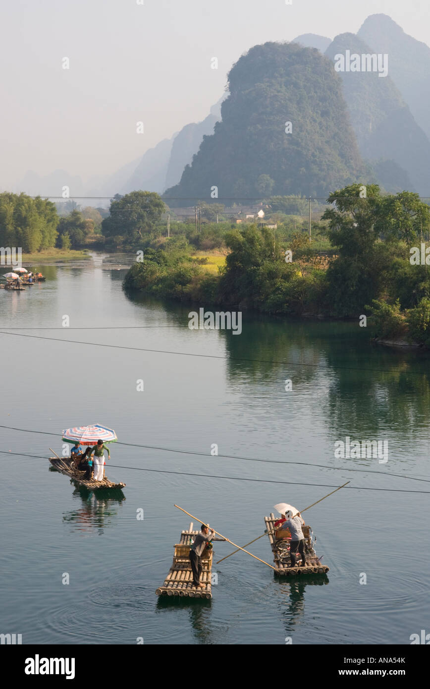 China Guangxi Yuangshuo Yulong bridge tourist cruise on typical bamboo ...