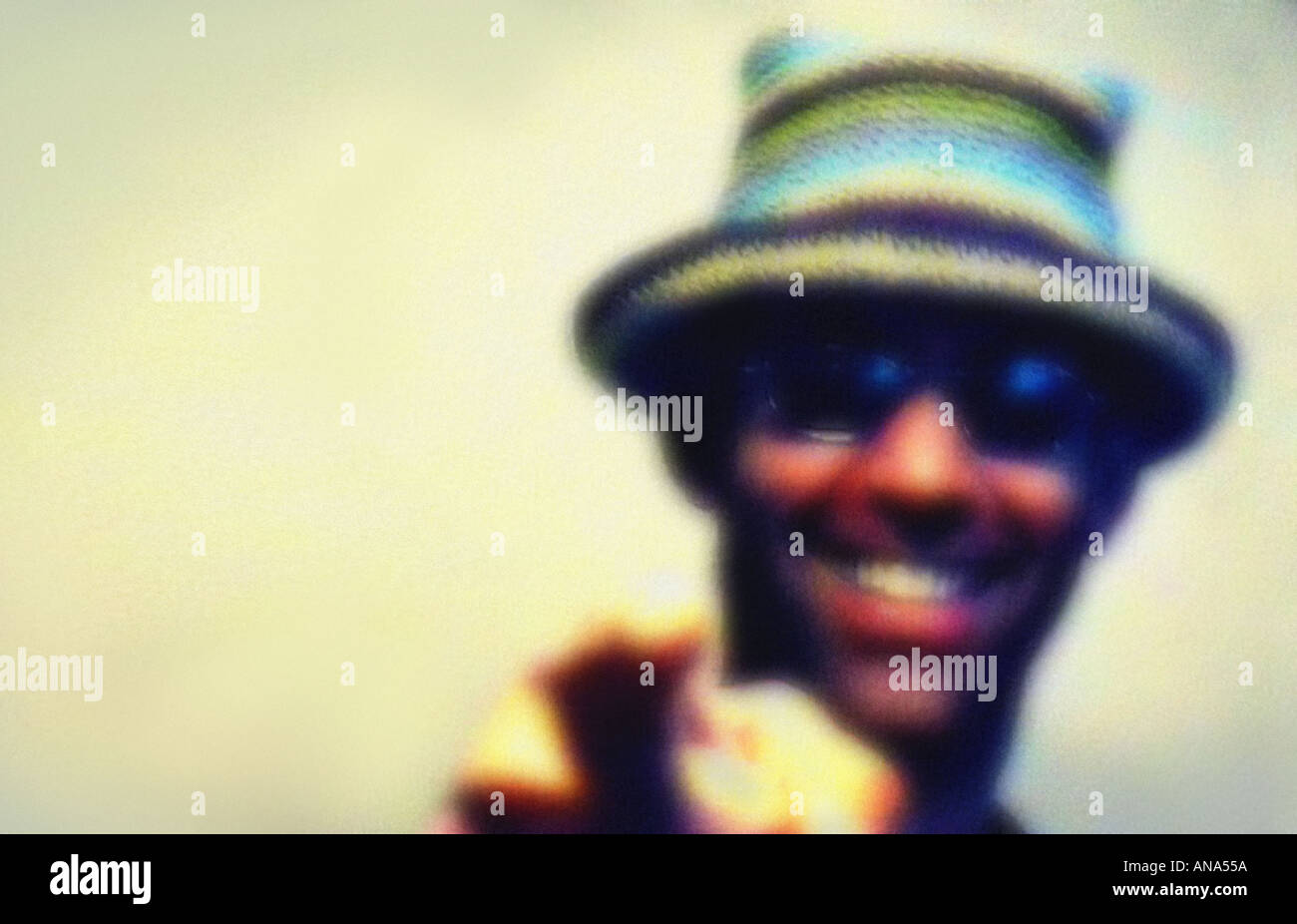 man model released wearing hat smiling and pointing Stock Photo - Alamy