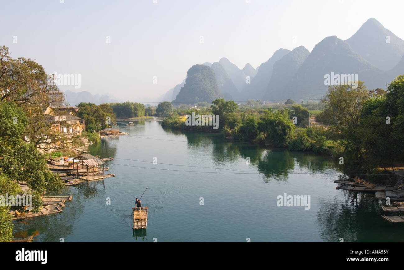 China Guangxi Yuangshuo Yulong bridge tourist cruise on typical bamboo ...