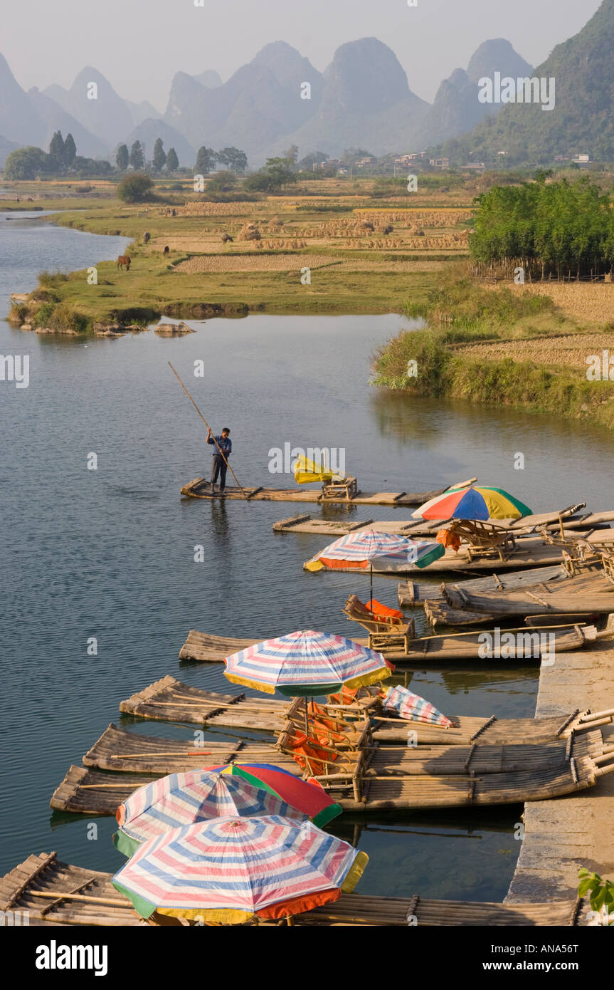China Guangxi Yuangshuo Yulong bridge view with tourist bamboo rafts ...