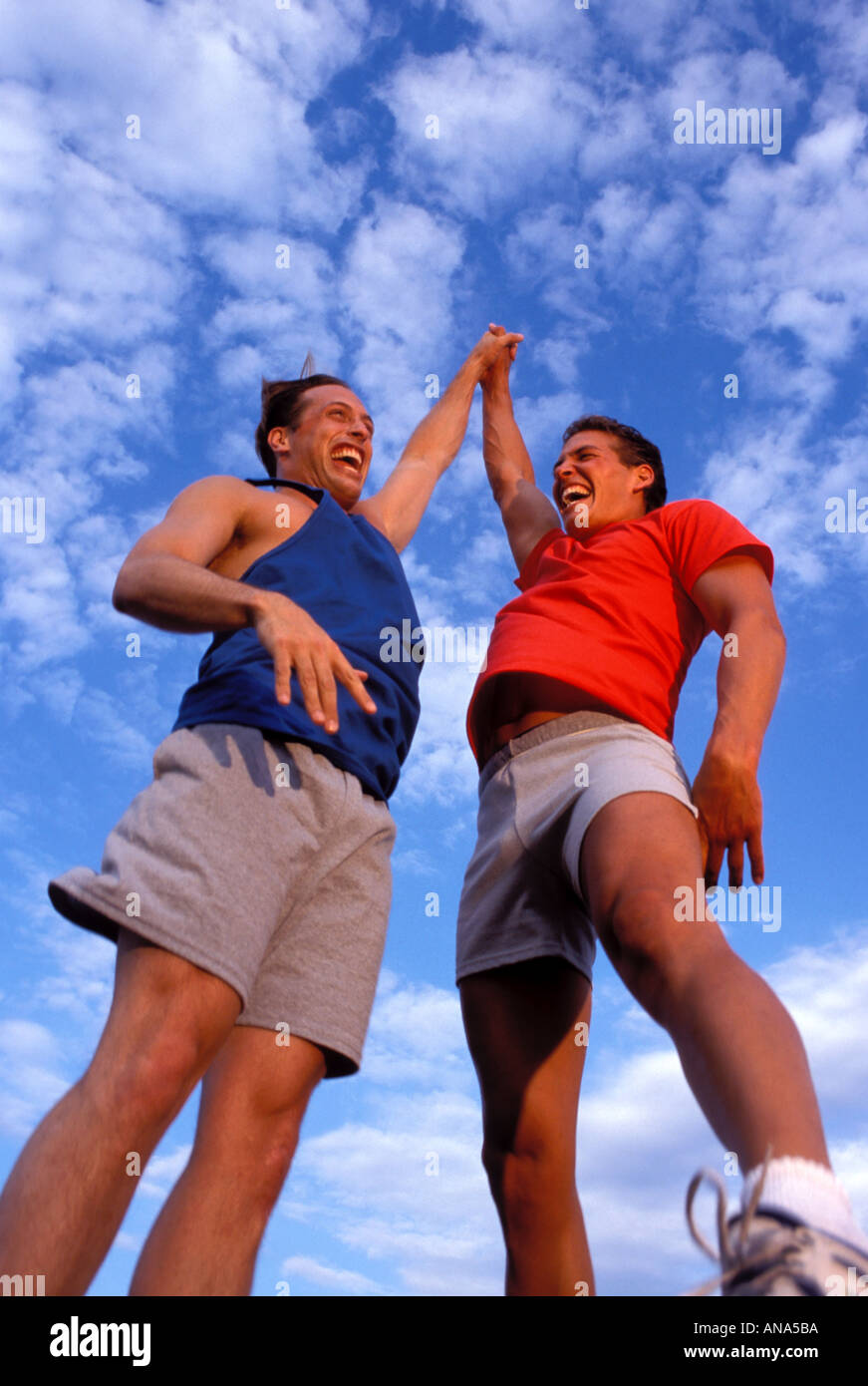 Sport Men high five in victory Stock Photo - Alamy