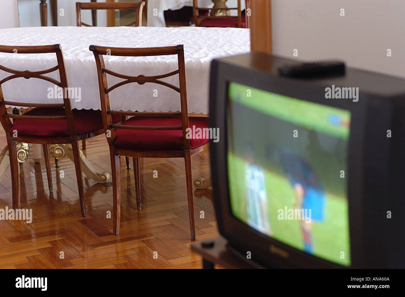 living room tv set football empty nobody remote control boring on ...