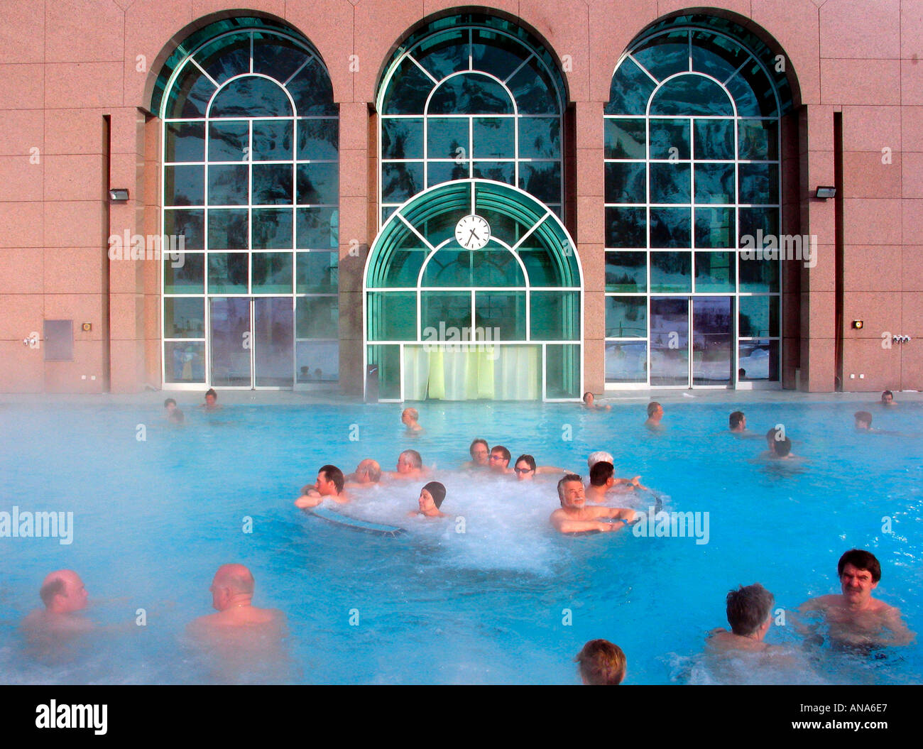 People bath in a medicinal hot water spring pool of Walliser ...
