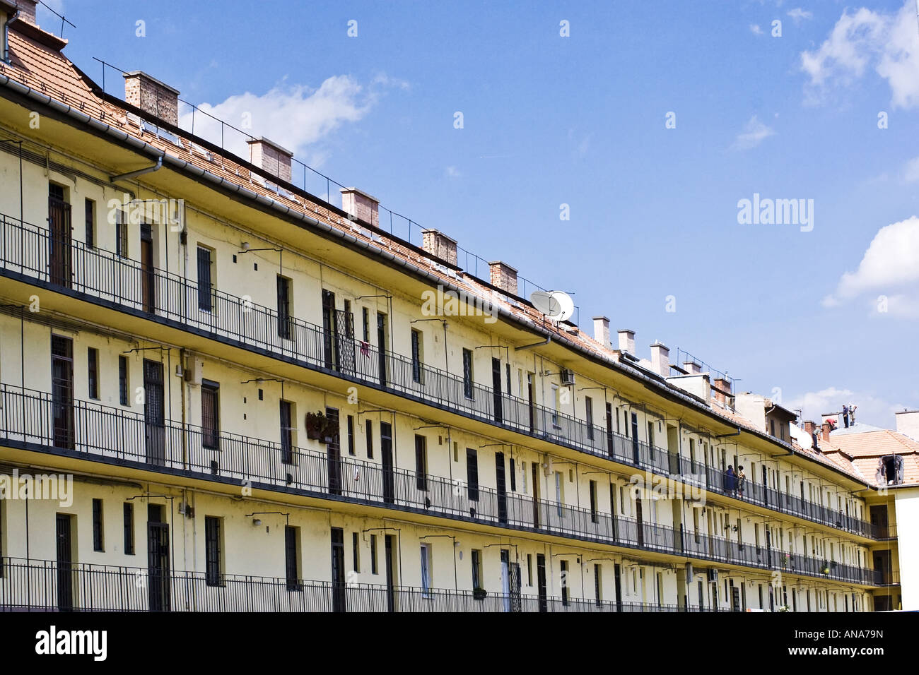 Long building with balcony Stock Photo - Alamy