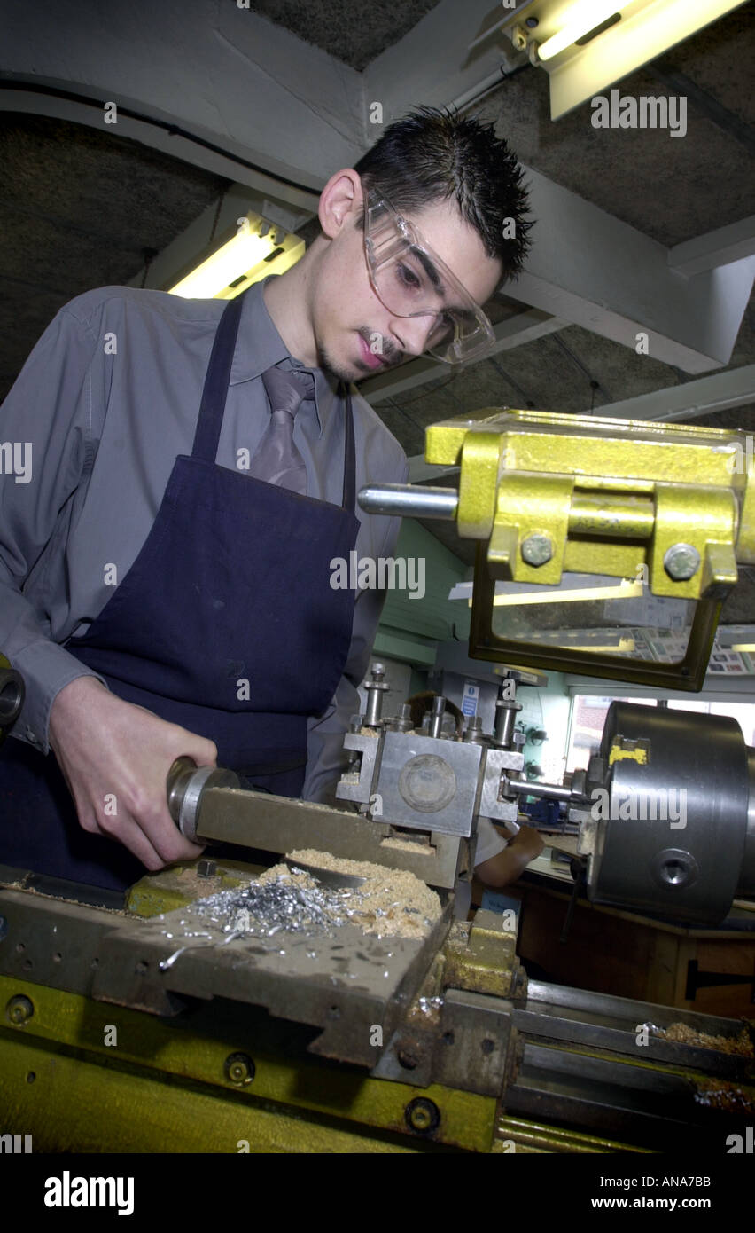 Male student working with a laith in metal work UK Stock Photo - Alamy