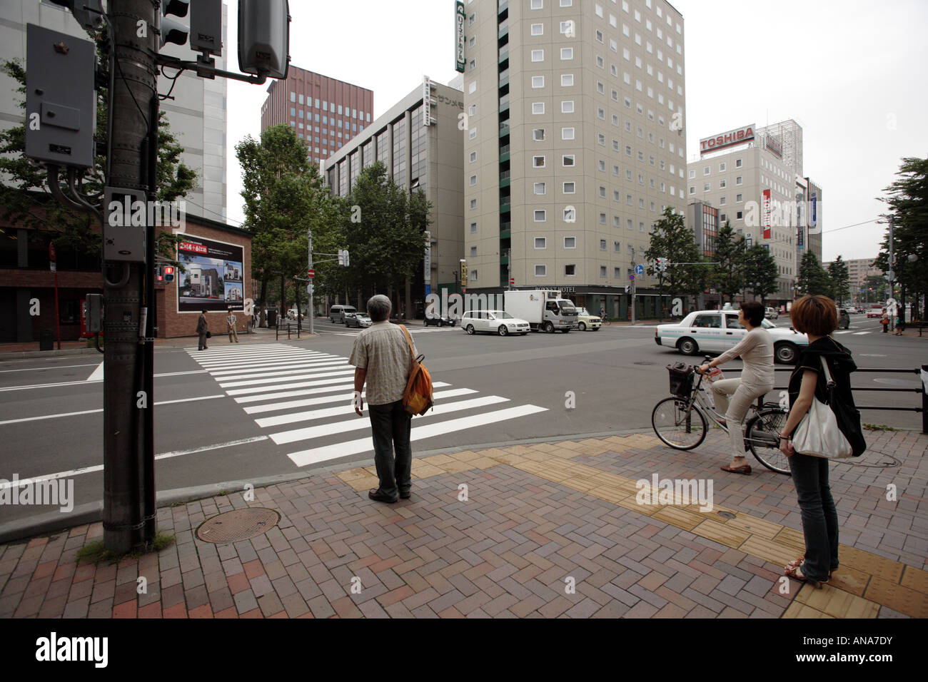 Pedestrians at a crosswalk in Sapporo Japan Stock Photo - Alamy