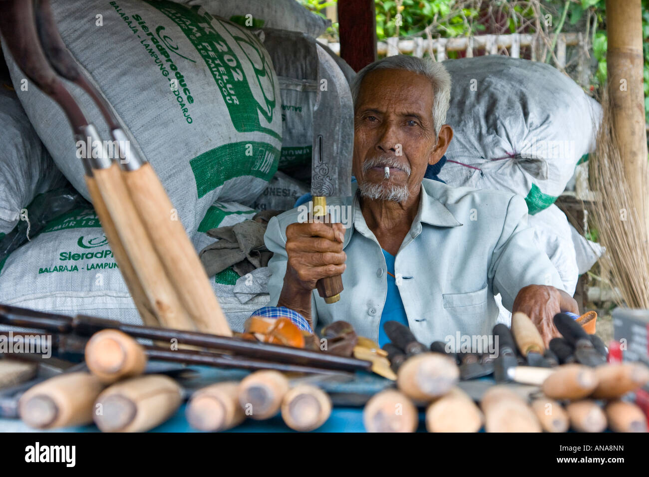 Old Man Selling Knives and Sharp Tools Bali Indonesia Stock Photo - Alamy