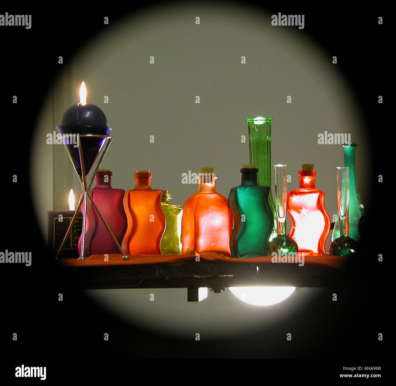 light shining through coloured bottles Stock Photo - Alamy