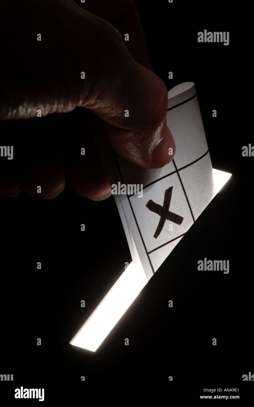 Hand inserting ballot paper into ballot box slot Stock Photo - Alamy