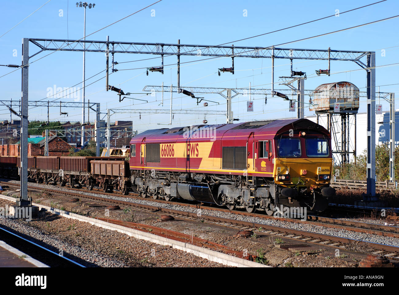 EWS class 66 diesel locomotive pulling empty ballast train at Rugby ...