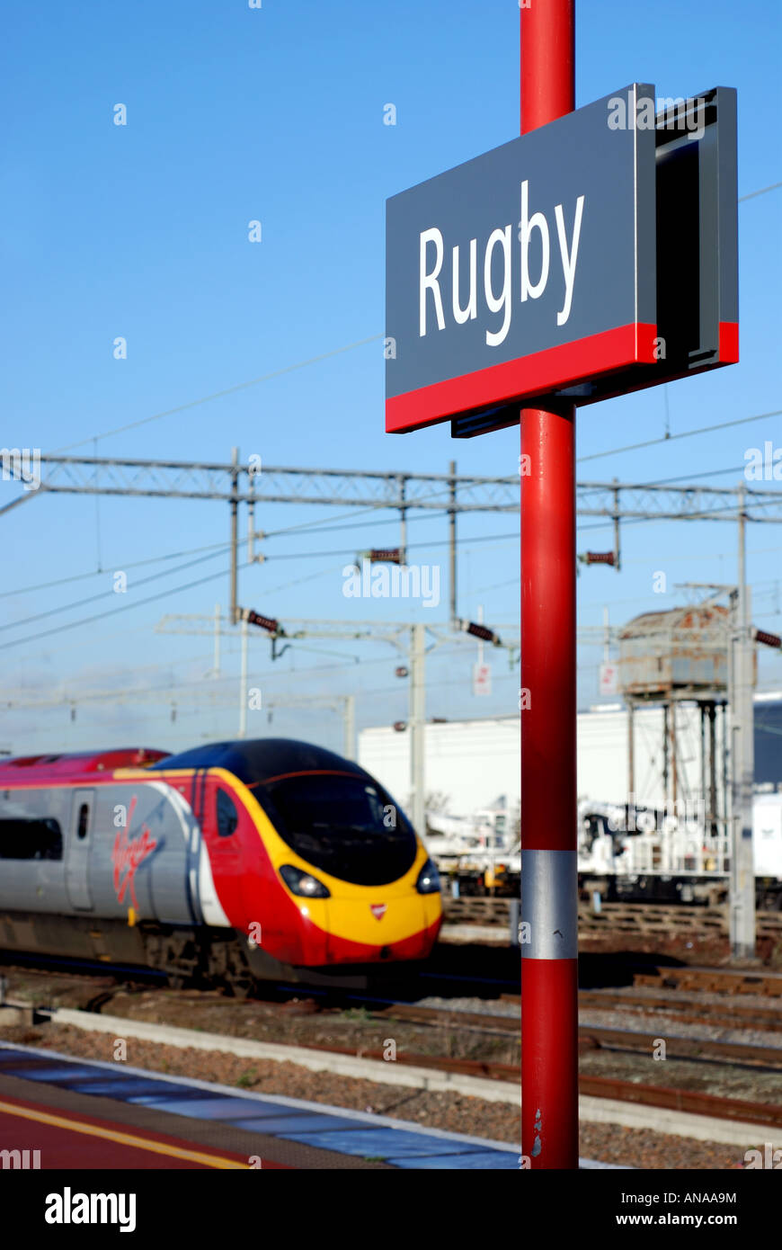 Rugby railway station sign and Virgin Pendolino train, Warwickshire ...