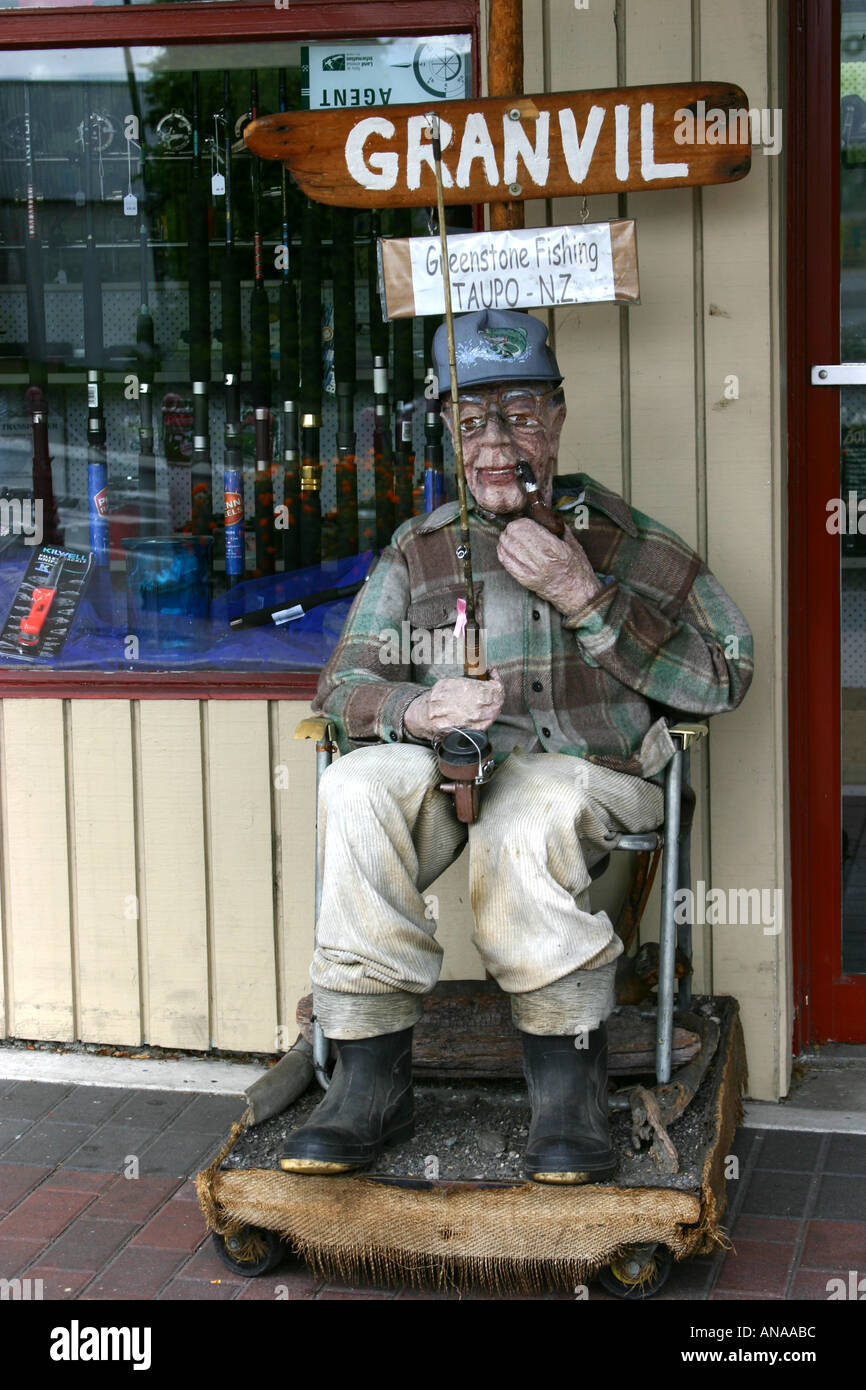 Fisherman dummy in a rocking chair in front of shop Taupo North Island ...