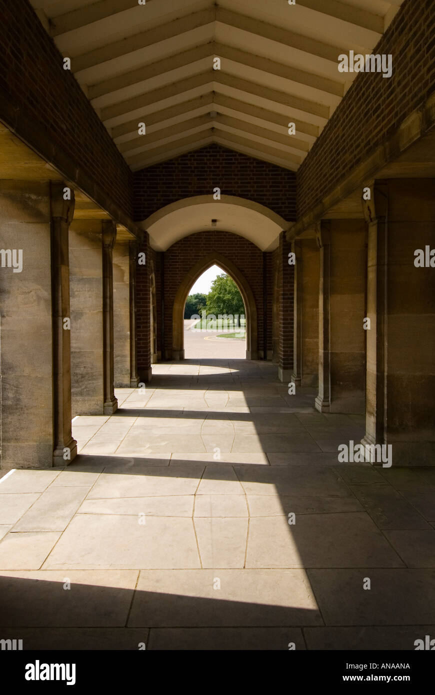 Sunlight through stone walkway Stock Photo - Alamy