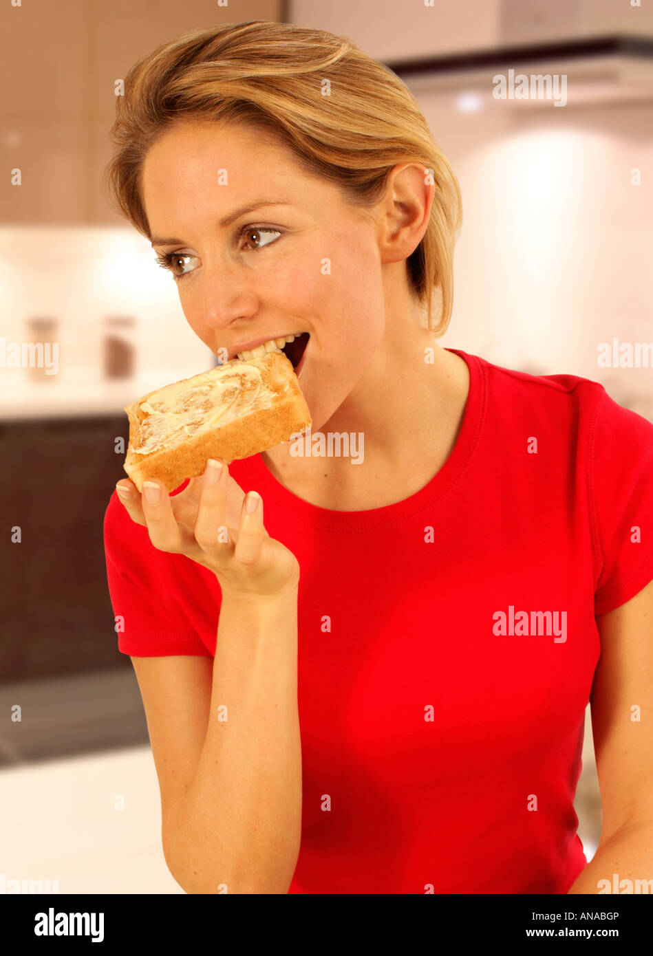 GIRL EATING TOAST Stock Photo - Alamy