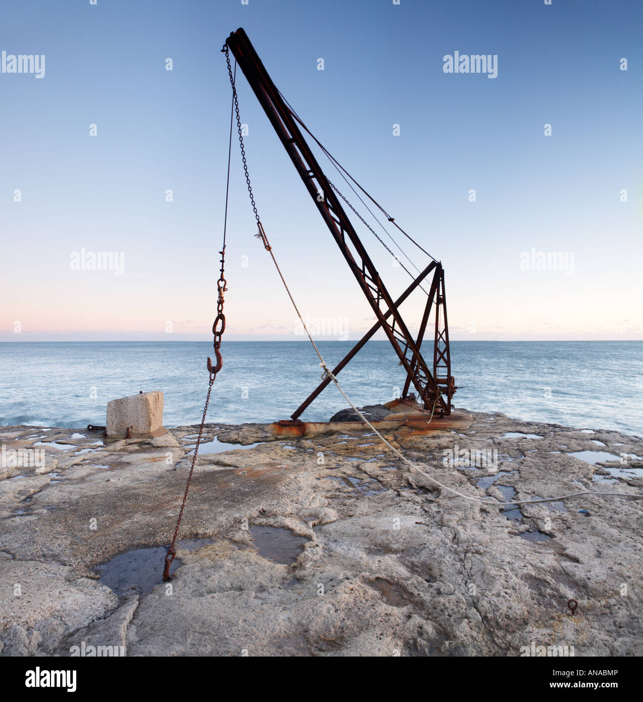 Rusty red crane near Portland Bill lighthouse, Dorset county, England ...