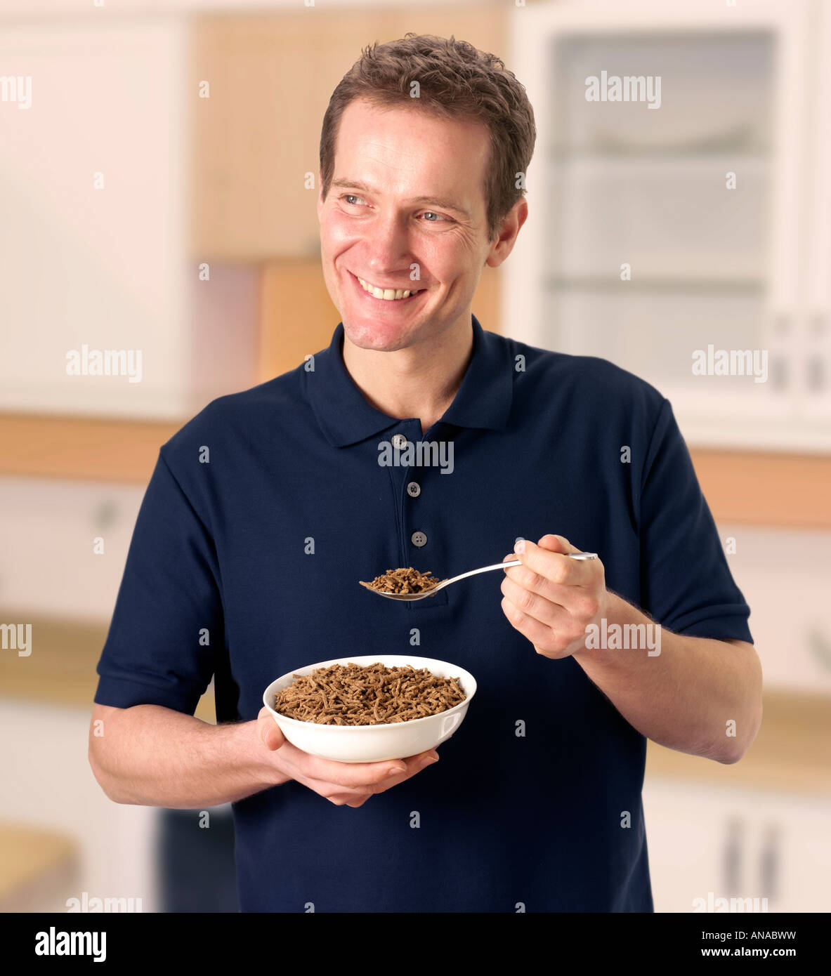 MAN EATING ALLBRAN CEREAL Stock Photo - Alamy