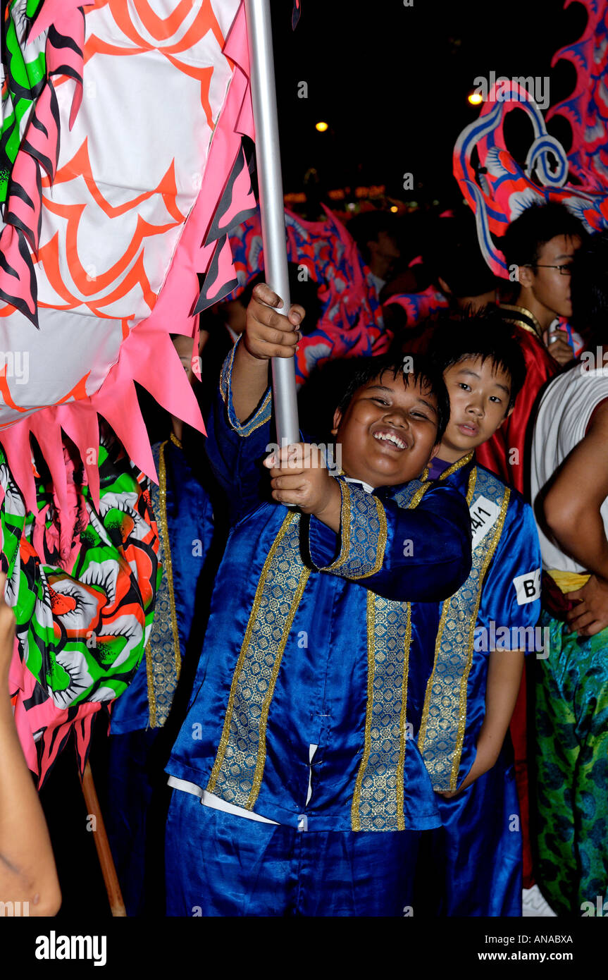Chingay - young man smiling waving his flag at the Chingay parade in ...