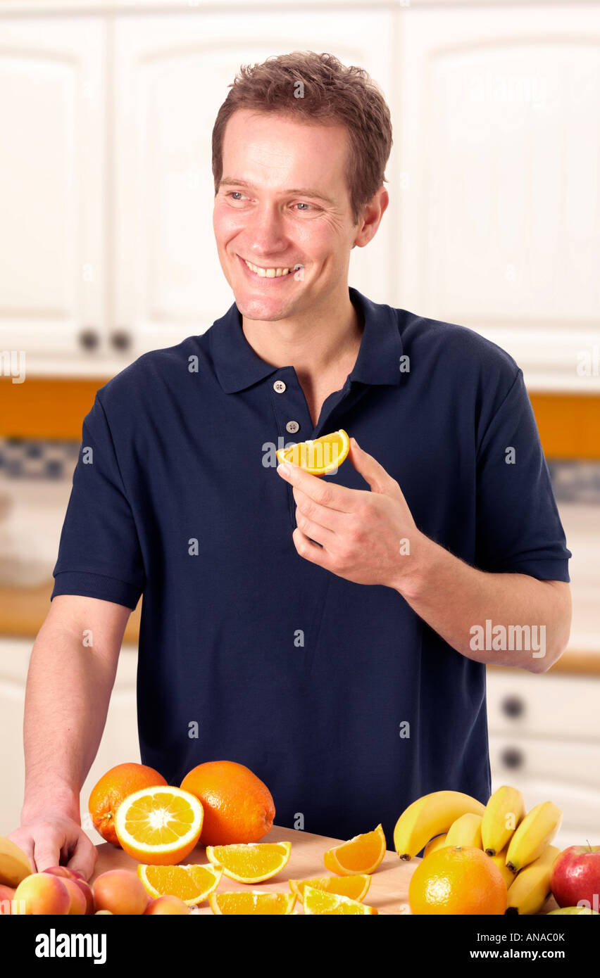 Standing man in orange hi-res stock photography and images - Alamy